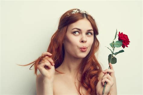 Premium Photo Portrait Of Young Woman Holding Flower