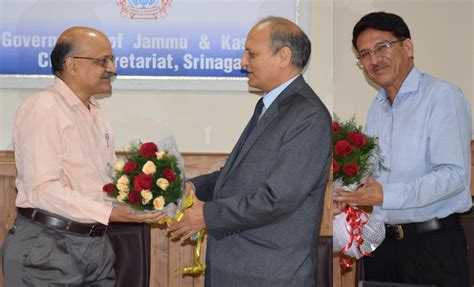 Chief Secretary Bvr Subrahmanyam Presenting Bouquet To Suresh Kumar And Anil Kumar Gupta In A