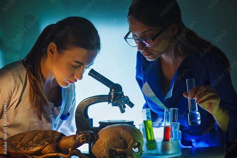 Babe Girl Looking In A Microscope Science Laboratory Concept Two Beautiful Babegirls