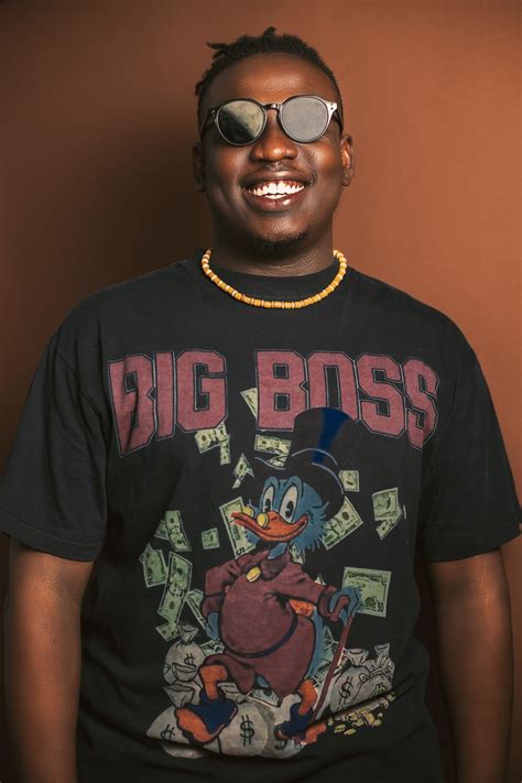 A Man Wearing A Big Boss T Shirt And Sunglasses Photo Free Ghana