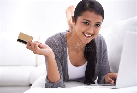 Purchasing Online Has Never Been Easier A Beautiful Young Woman Using