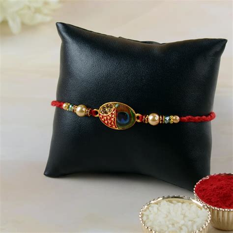 Peacock Feather Oval Rakhi Designer Rakhi