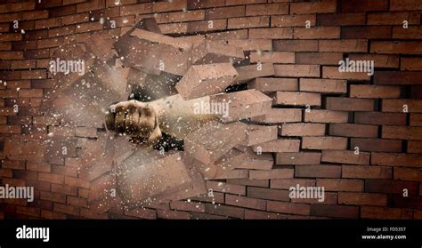 Man Breaking Through Brick Wall