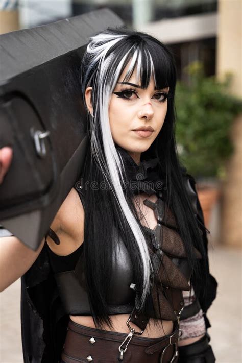 Pretty Female Cosplayer Dressed As An Anime Warrior With Sword Stock