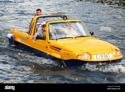 A Vintage Amphibious Dutton Car Travelling Down The River Thames At The