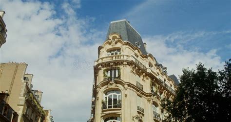 The Facade Of Triangular Historical Building With A Corner At