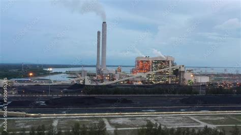 Tracking Shot Across Industrial Ultra Supercritical Coal Fired Power Plant With Smokes Raising