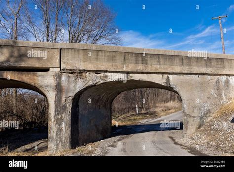 Old Rural Railroad Bridge With Crumbling Cracking Concrete Concept Of