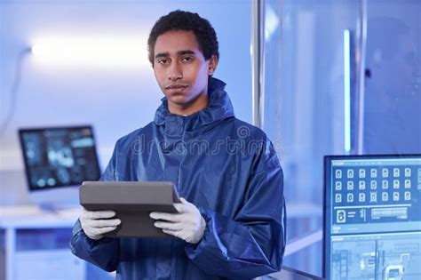male scientist at desk in laboratory analyzing scientific data stock