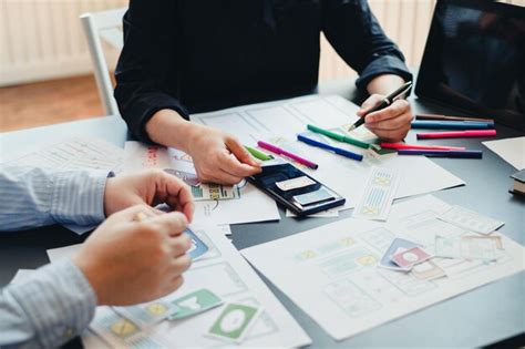 Premium Photo Mobile Application Designers Plan Together In The Office