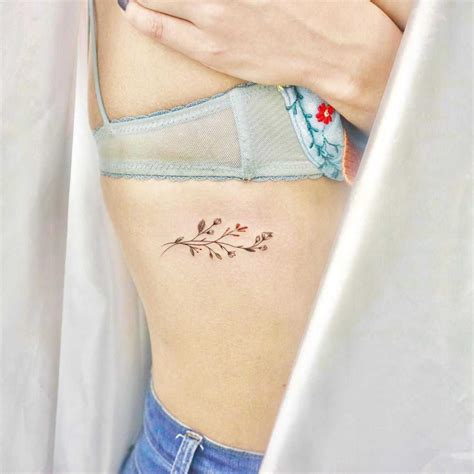 Tiny Flower On The Rib By Xenaink