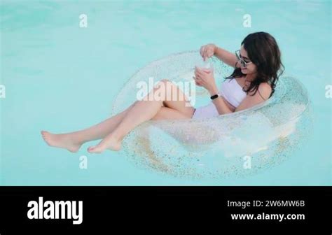 Vacation Woman On Inflatable Float Mattress Having Fun In Swimming Pool