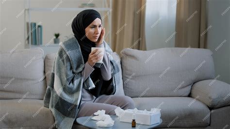 Premium Photo Sick Young Woman In Black Hijab Wrapped Herself In