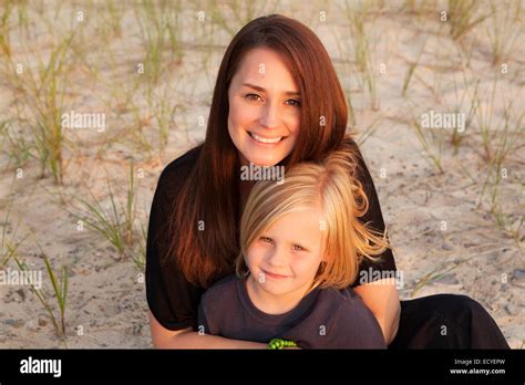 Caucasian Mother Hugging Son On Beach Stock Photo Alamy