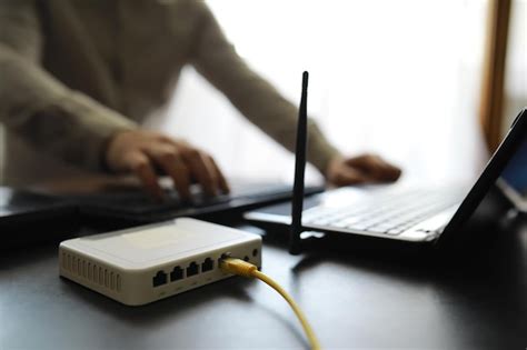 Premium Photo Modern Dual Band Wireless Router Man Working In The Background Fast And Wireless