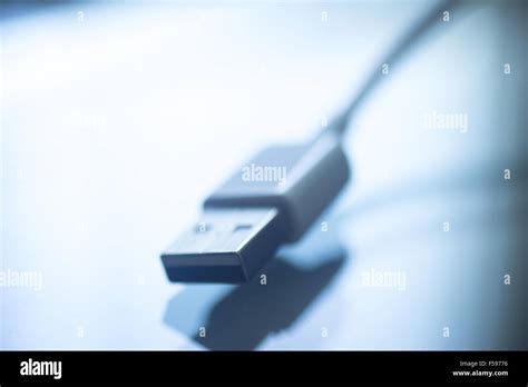 USB Cable IT PC Memory Storage Dongle Plug Socket Close Up Color Artistic Photo In Blue Tones