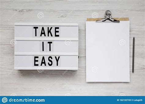 `take It Easy` Words On A Modern Board Clipboard With Blank Sheet Of