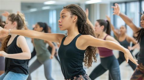 Premium Photo A Group In A Dance Class Performing Various Dance Poses