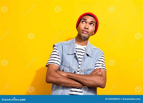 Photo Of Minded Creative Person Folded Arms Look Interested Empty Space