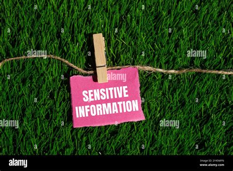Sensitive Information Message Written On Ripped Torn Pink Paper Piece