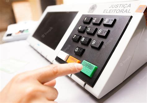 Premium Photo Person Simulates Voting In The Electronic Ballot Box