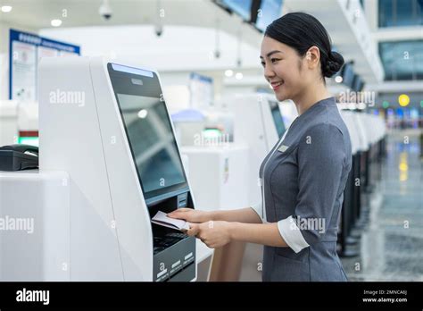 Smile Of A Flight Attendant Demonstration Self Service Check In Stock