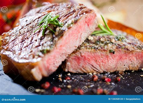 Sliced Grilled Meat Barbecue Steak Striploin With Knife And Fork