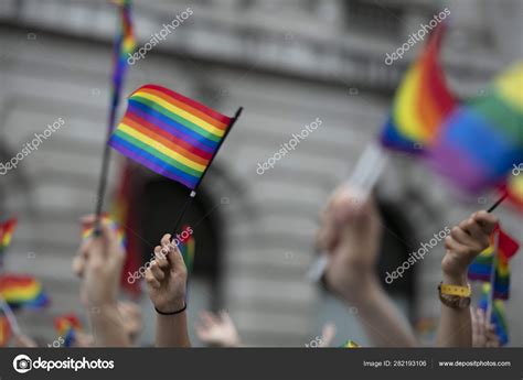 Crowds Of People Wave Gay Pride Flags At A Solidarity March — Stock