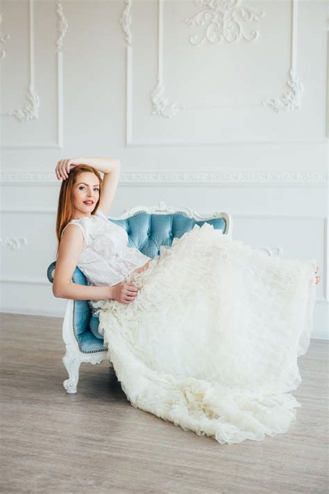Red Haired Pregnant Young Girl In A Blue Armchair Stock Image Image