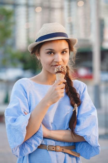 Premium Photo Portrait Of Woman Eating Ice Cream