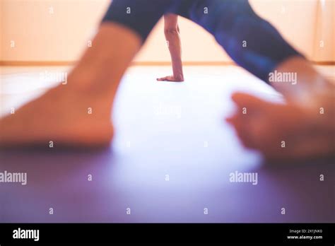 Unrecognizable Woman Yogi Resting On Hand And Feet In Balance Stock