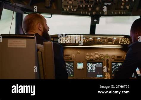 Flying Aircrew Preparing To Takeoff With Airplane In Cockpit Using