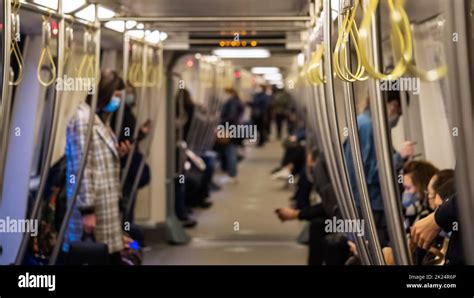 Hanging Handrails In A Metro Plastic Yellow Grip On Strap In Public