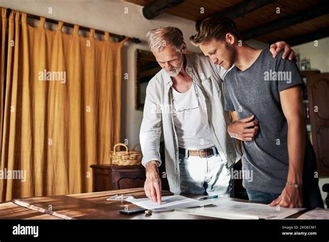Two Men Working Together On A Project Hi Res Stock Photography And