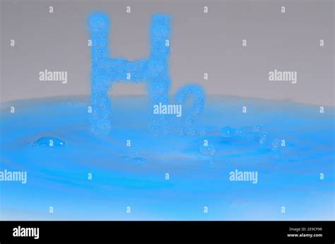 Blue Hydrogen H Letters Hovers Over Blue Liquid With Drops Stock Photo Alamy