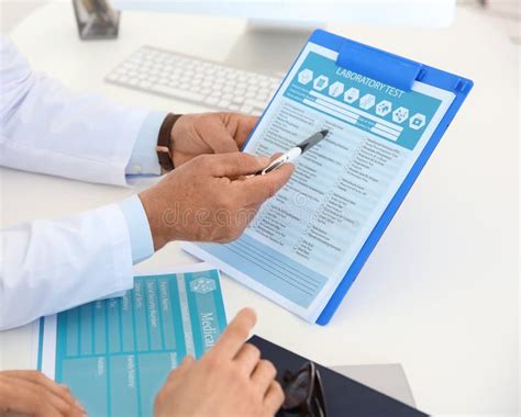 Urologist Showing Laboratory Test Form To Patient Stock Image Image