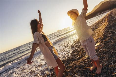 Brother And Sister Are Having Fun On The Beach Stock Image Image Of