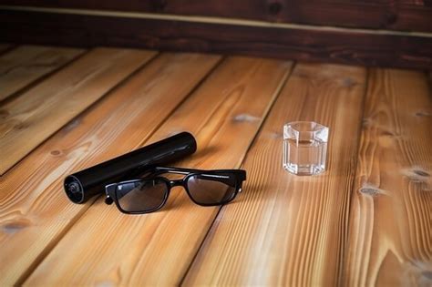 Premium Ai Image Spy Glasses Resting On A Wooden Table