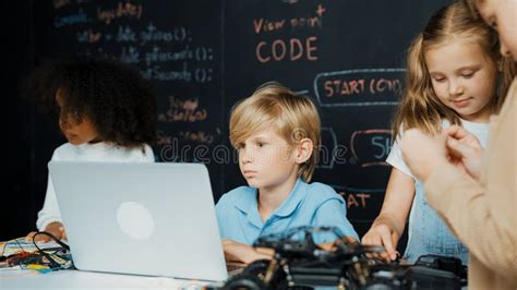 Boy Using Laptop Programing Engineering Code And Writing Program