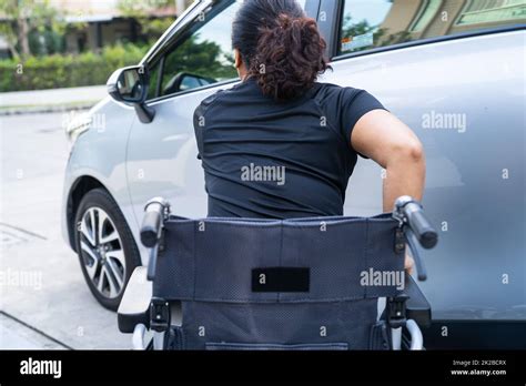 Asian Disability Woman On Wheelchair Getting In Her Car Accessibility