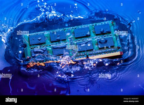Technology Cyber Electronic Concept Cpu Ram Computer Fall Into The Water On Blue Light