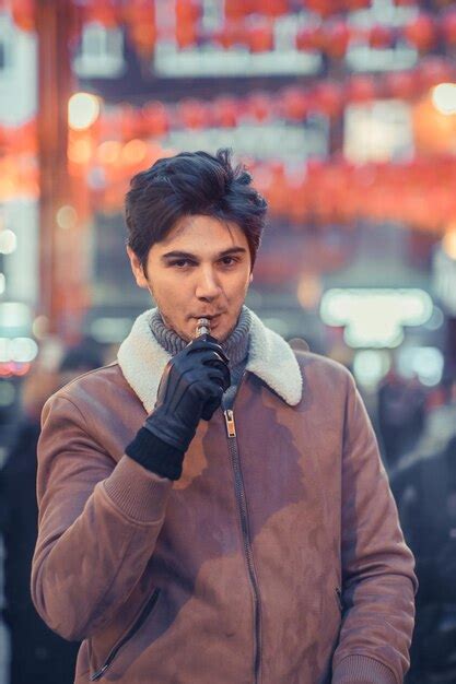 Premium Photo Portrait Of Man Smoking Pipe