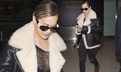 Rita Ora Flashes Her Bra In Mesh Top And Shearling Jacket Daily Mail