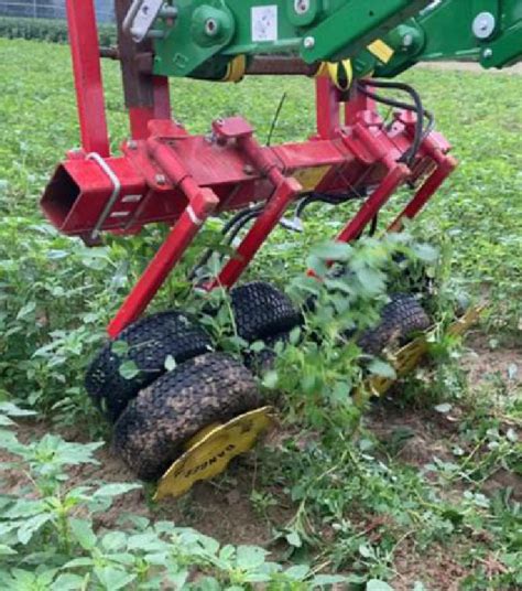 The Bourquin Organic Weedpuller Roguing Machine Posi Pull Removing Rows