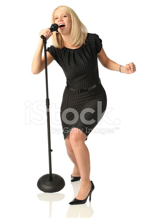 Woman Singing Into Microphone Stock Photo Royalty Free FreeImages