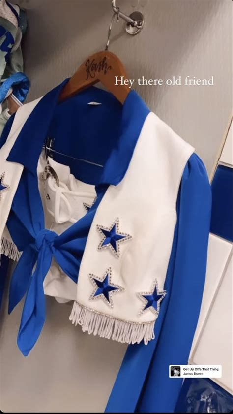 A Blue And White Scarf Hanging On A Wall