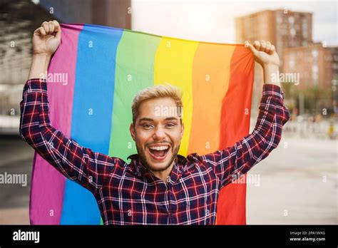 Happy Gay Man Wearing Makeup Holding Lgbt Rainbow Flag Outdoor Focus