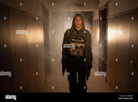 Brave Female Soldier Walking In A Polluted Post Apocalyptic Abandoned
