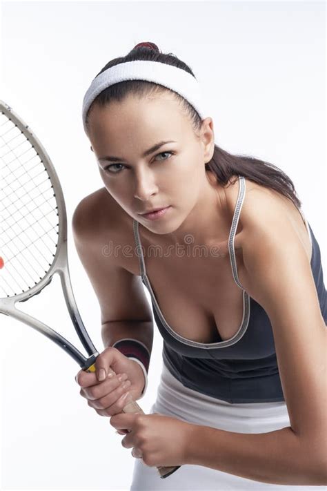 Winsome Young Caucasuan Sporty Fit Woman In Tennis Outfit Posing With