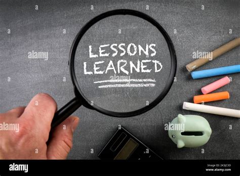 Lessons Learned Education Concept Chalk Board And Magnifying Glass Stock Photo Alamy